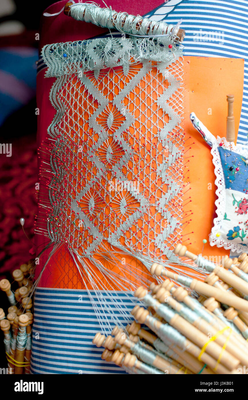 Bobbin lace is a lace textile made by braiding and twisting lengths of ...