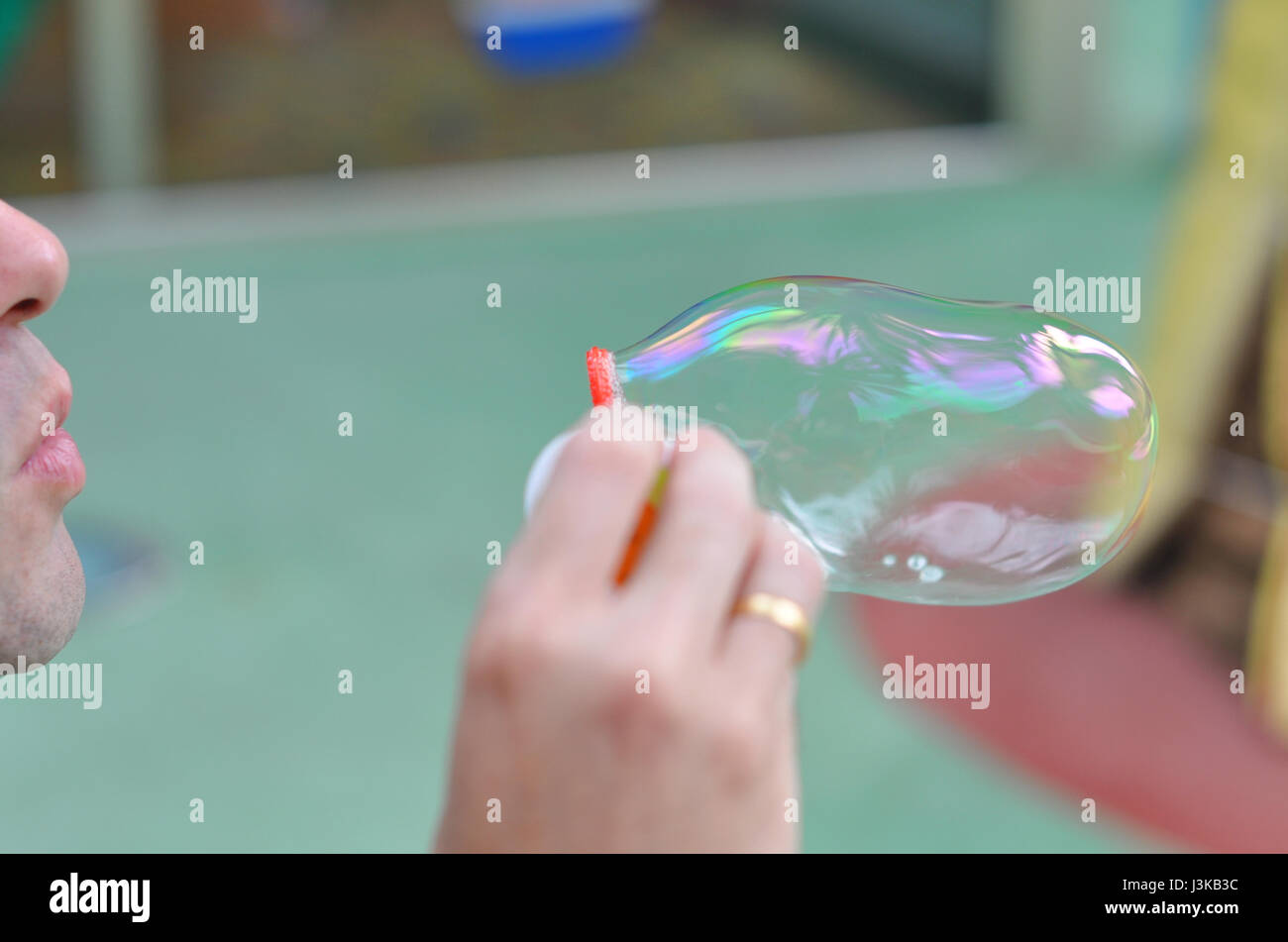 Man making some soap bubbles Stock Photo - Alamy