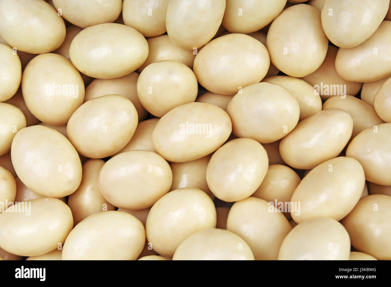 White chocolate balls. Chocolate drops as background texture pattern ...