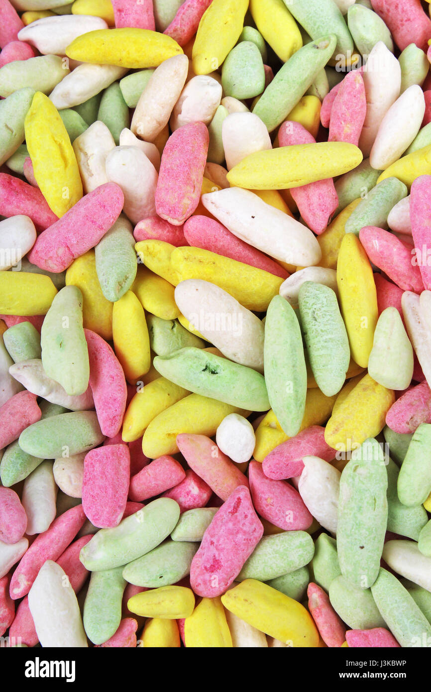 Candy from puffed rice grains. Sweet flavored puffed rice grains ...