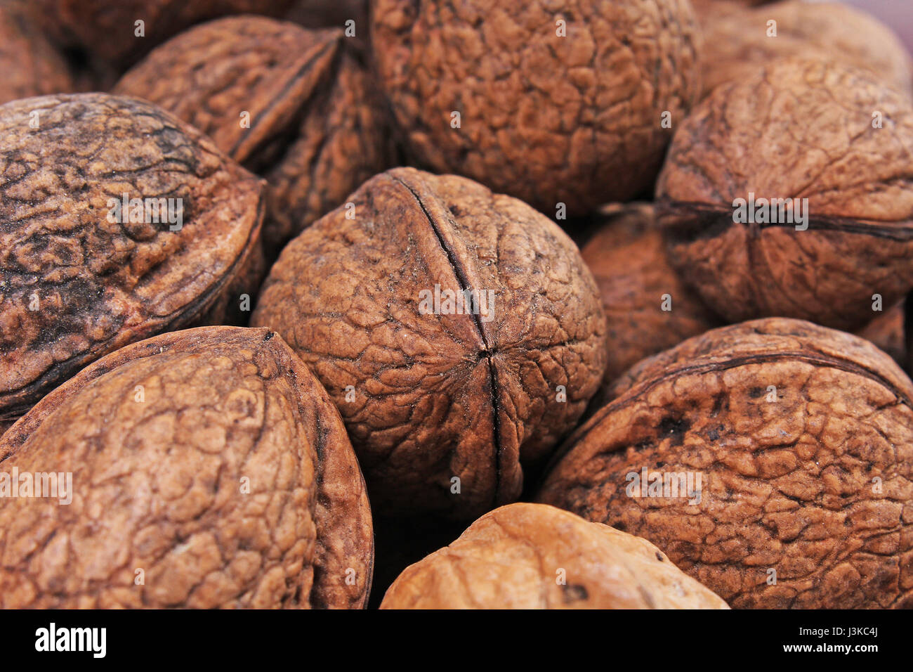 Walnut texture. Brown big walnuts as background. walnut nuts pattern ...