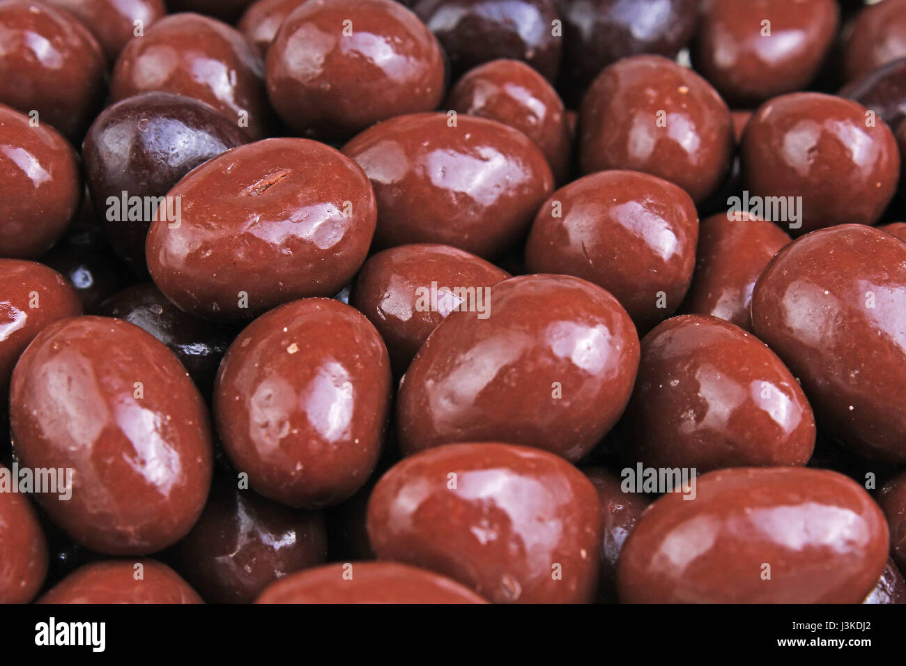 Dark and dairy chocolate balls. Chocolate drops as background texture ...