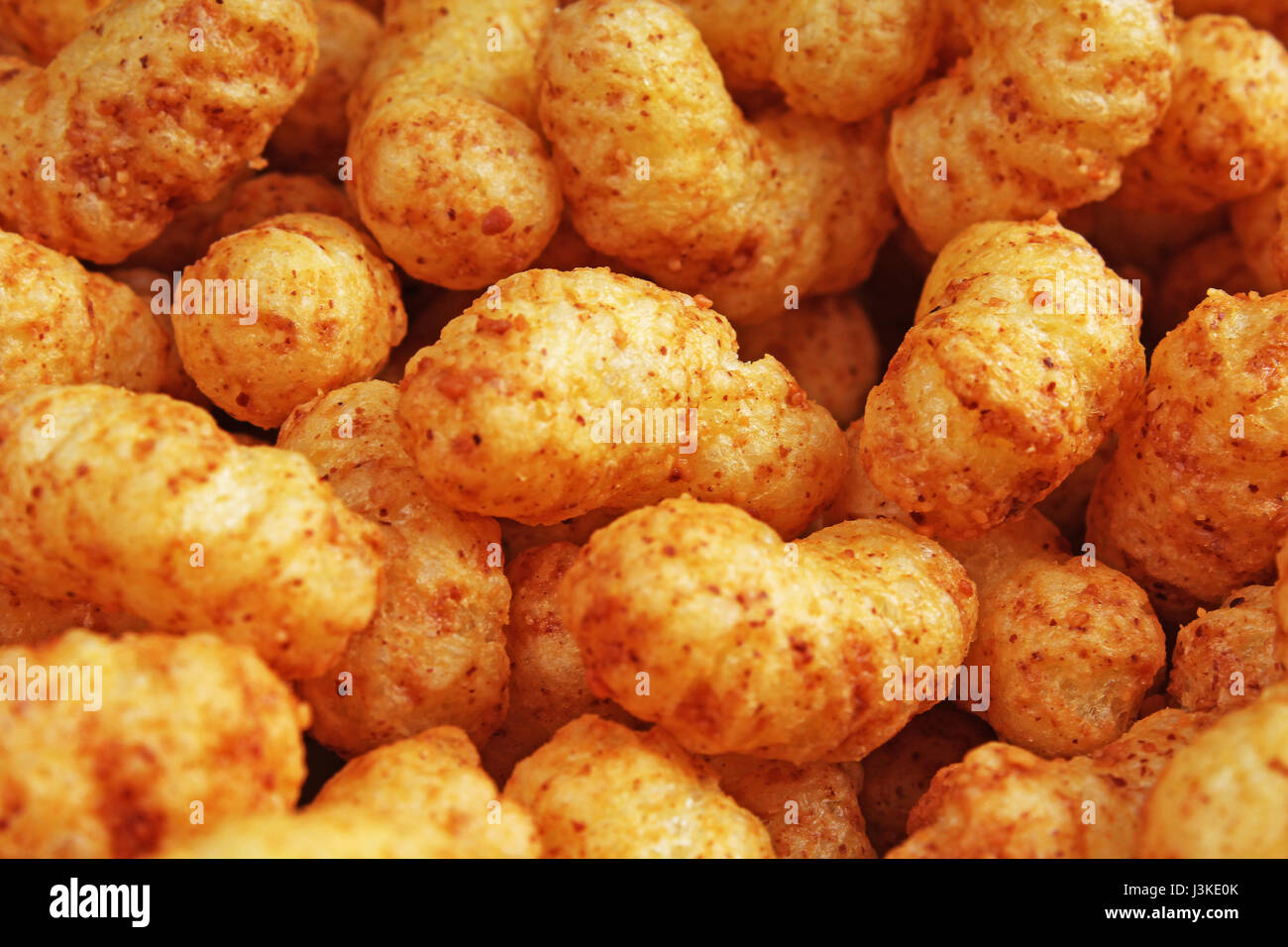Cheese puff. Cheese puffs snack background texture food pattern Stock ...