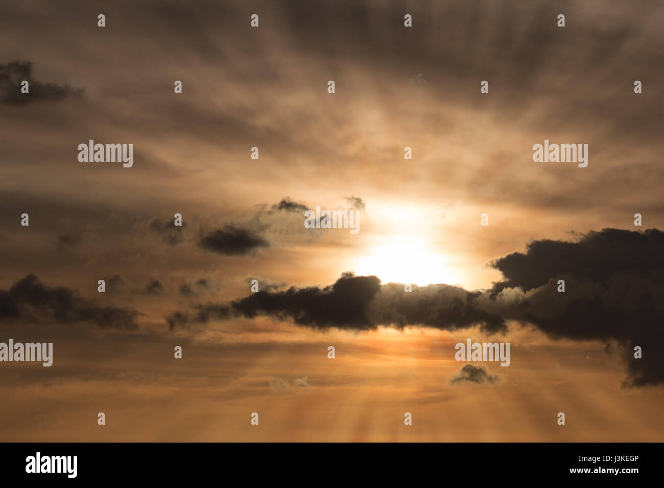 Sunrays behind clouds hi-res stock photography and images - Alamy