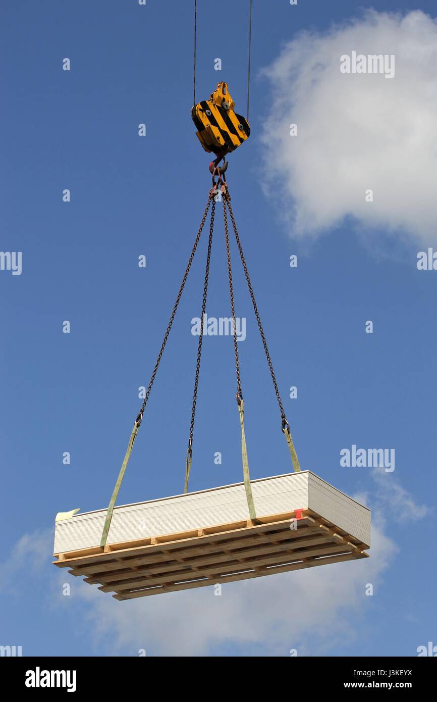 Construction crane lifting pallet building hi-res stock photography and ...