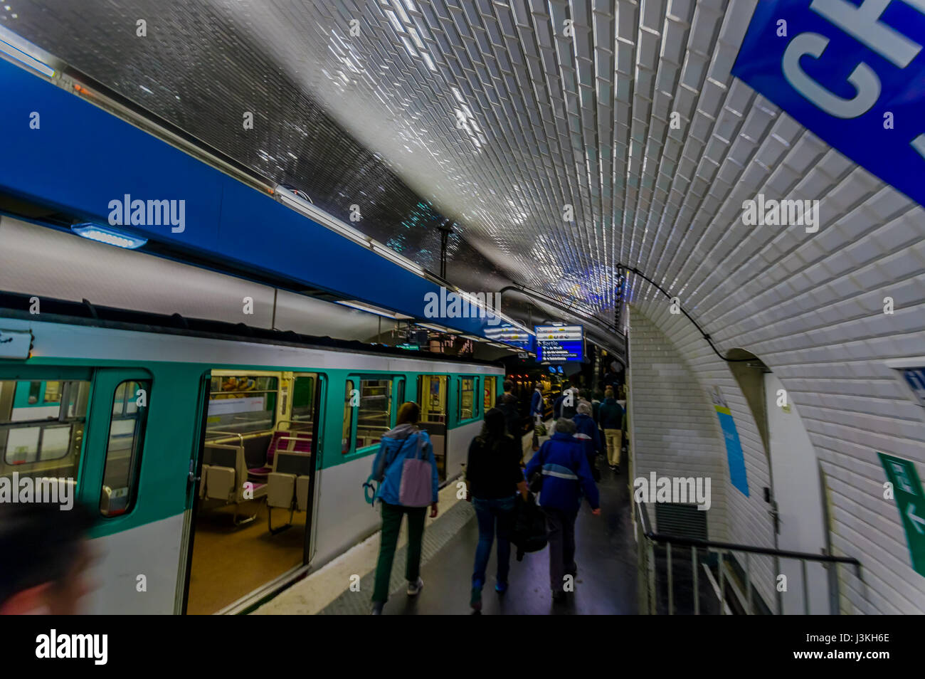 Paris, France June 1, 2015: Train inside Parisian metro station, people ...