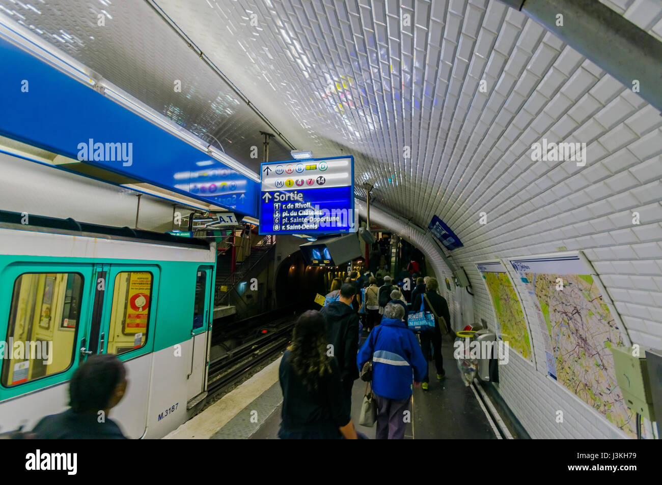 Paris, France June 1, 2015: Train inside Parisian metro station, people ...