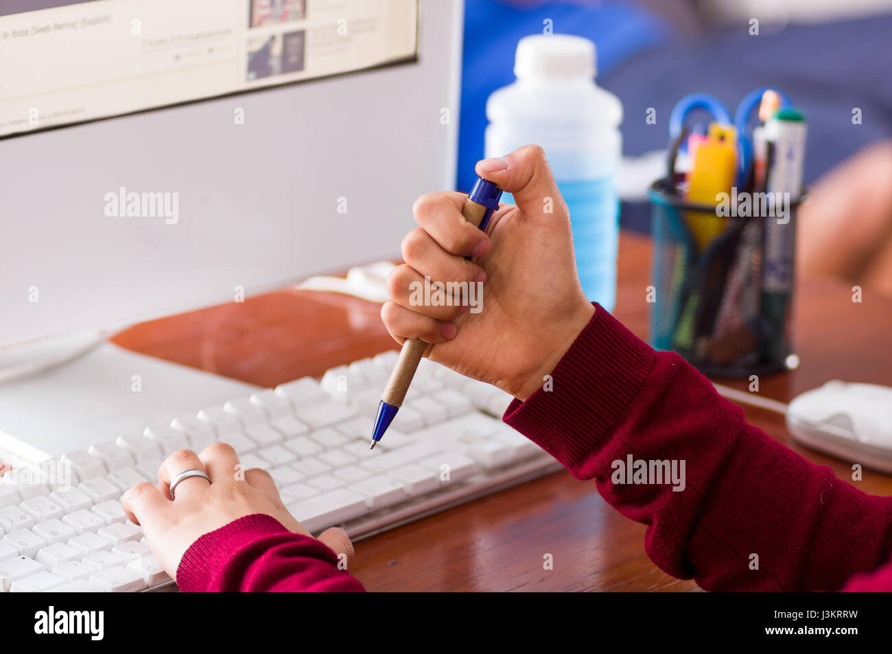 Close-up of a female hand holding a pen. fiddling concept Stock Photo ...