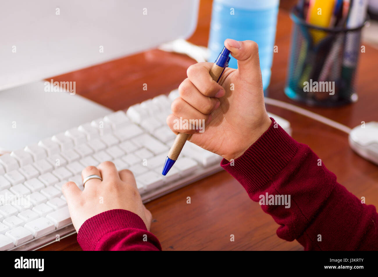 Close-up of a female hand holding a pen. fiddling concept Stock Photo ...