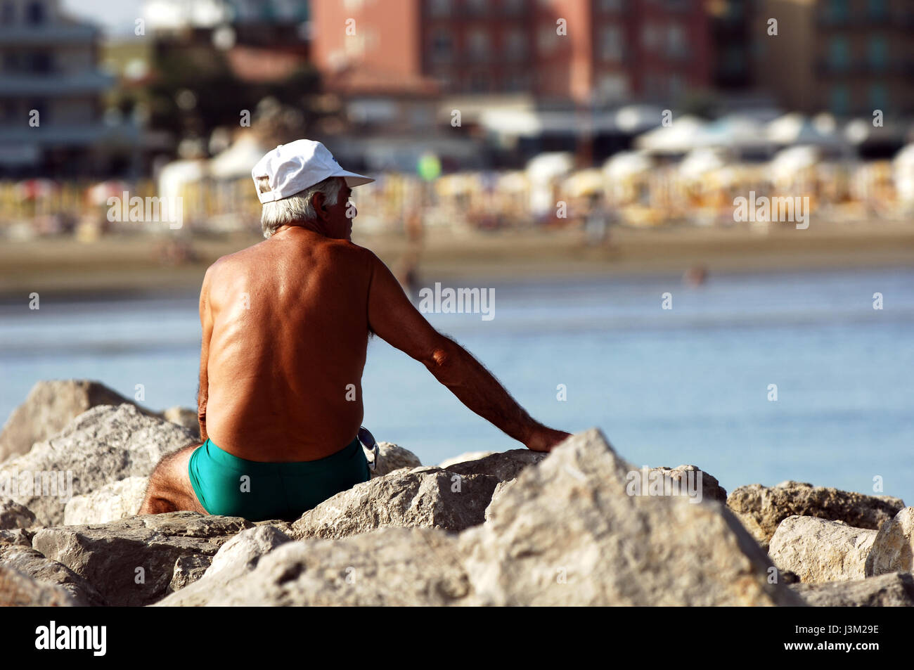 Retired Senior Man expatriate relaxing looking at the sea Stock Photo ...