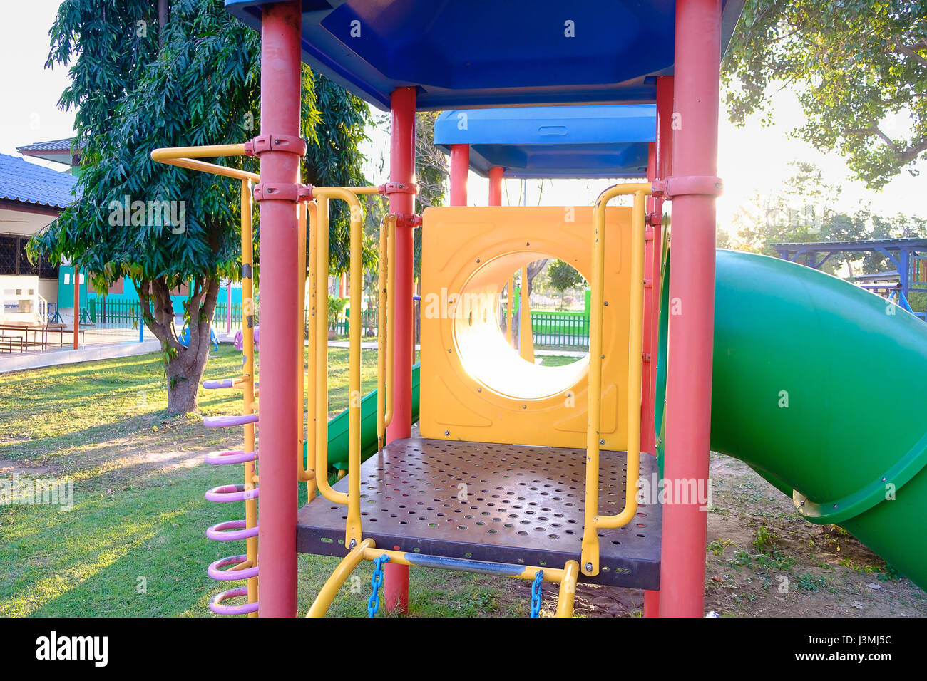 empty playground have colorful slide, tube and stair Stock Photo - Alamy