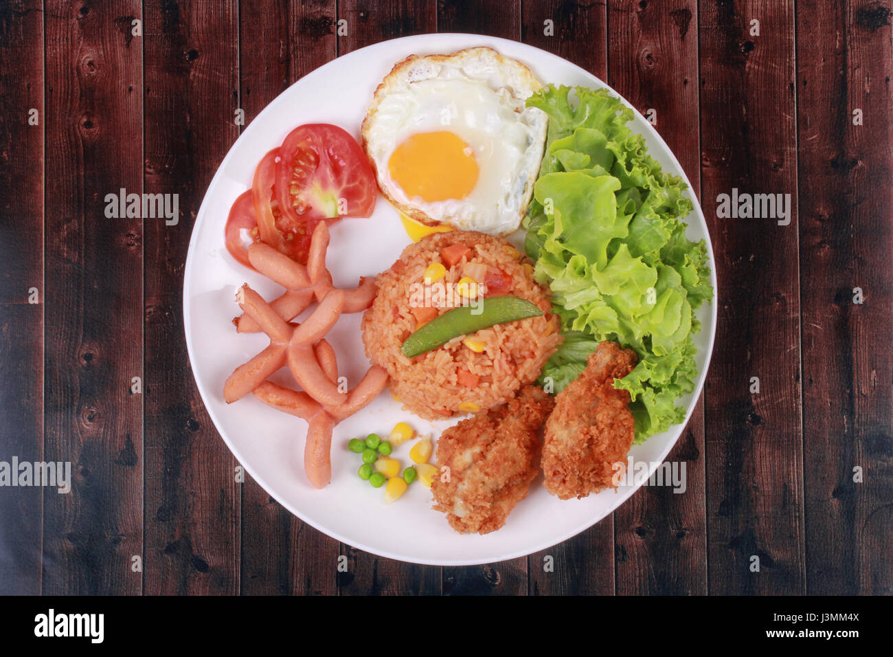 American style breakfast set, American fried rice topped sunny up egg ...