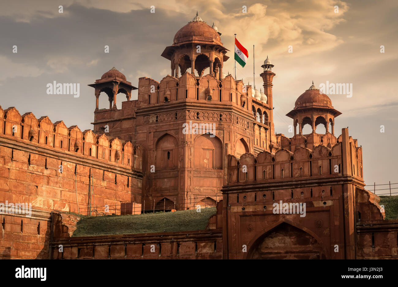 Red Fort Delhi at sunset with moody sky. Red Fort is a red sandstone ...