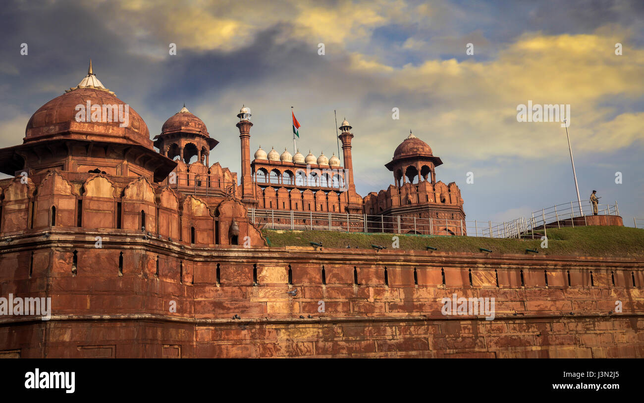 Red Fort Delhi at sunset with moody sky. Red Fort is a red sandstone ...