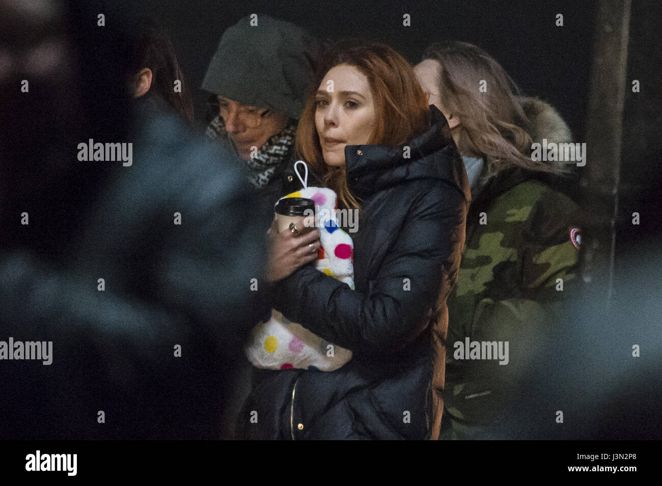 Elizabeth Olsen feels the cold as she films scenes for upcoming movie ...