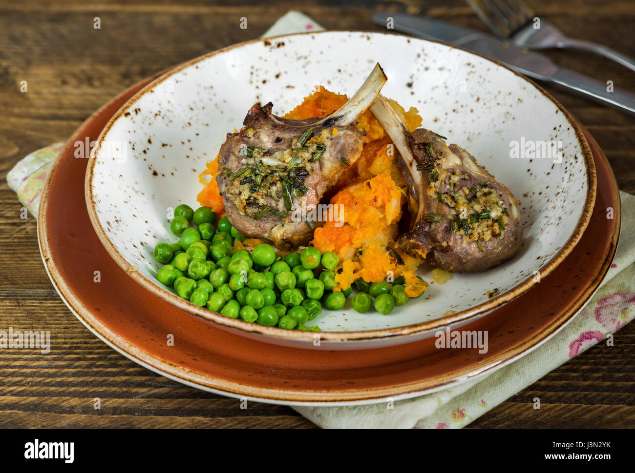 Rosemary lamb chops dinner with carrot and parsnip mash and green peas ...