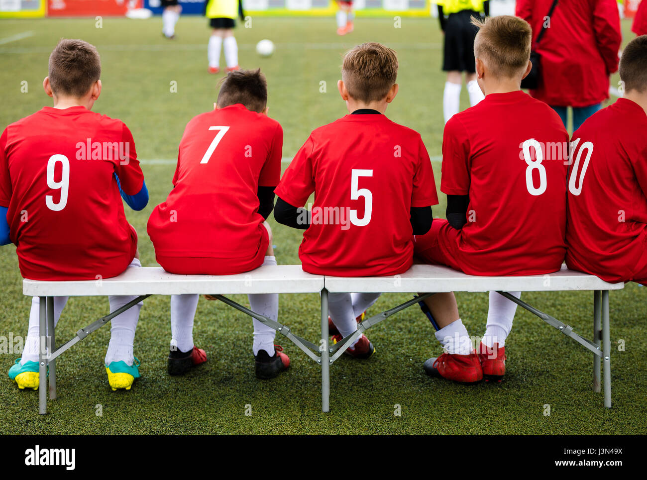 Youth Sport Soccer Team Sitting on Bench. Young Footballers as ...