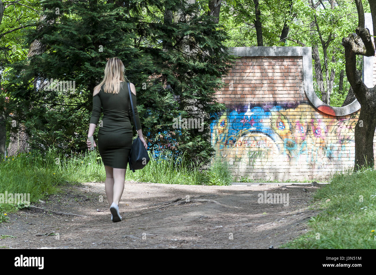 Woman from behind dress walking hi-res stock photography and images - Alamy
