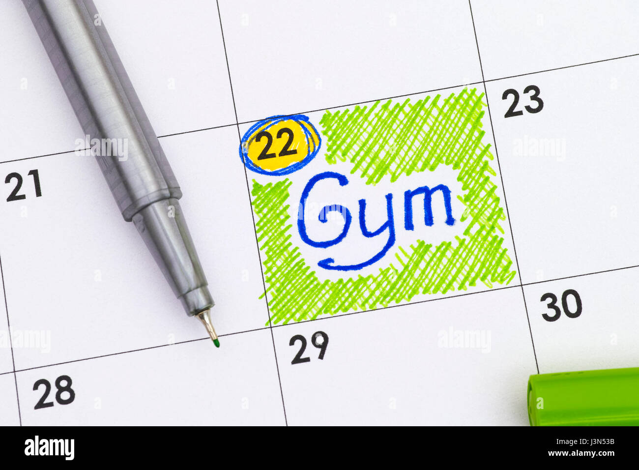 Reminder Gym in calendar with green pen Stock Photo - Alamy