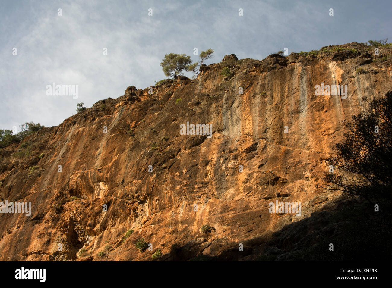 Lissos Gorge with its steep limestone walls at the Southwest coast of ...