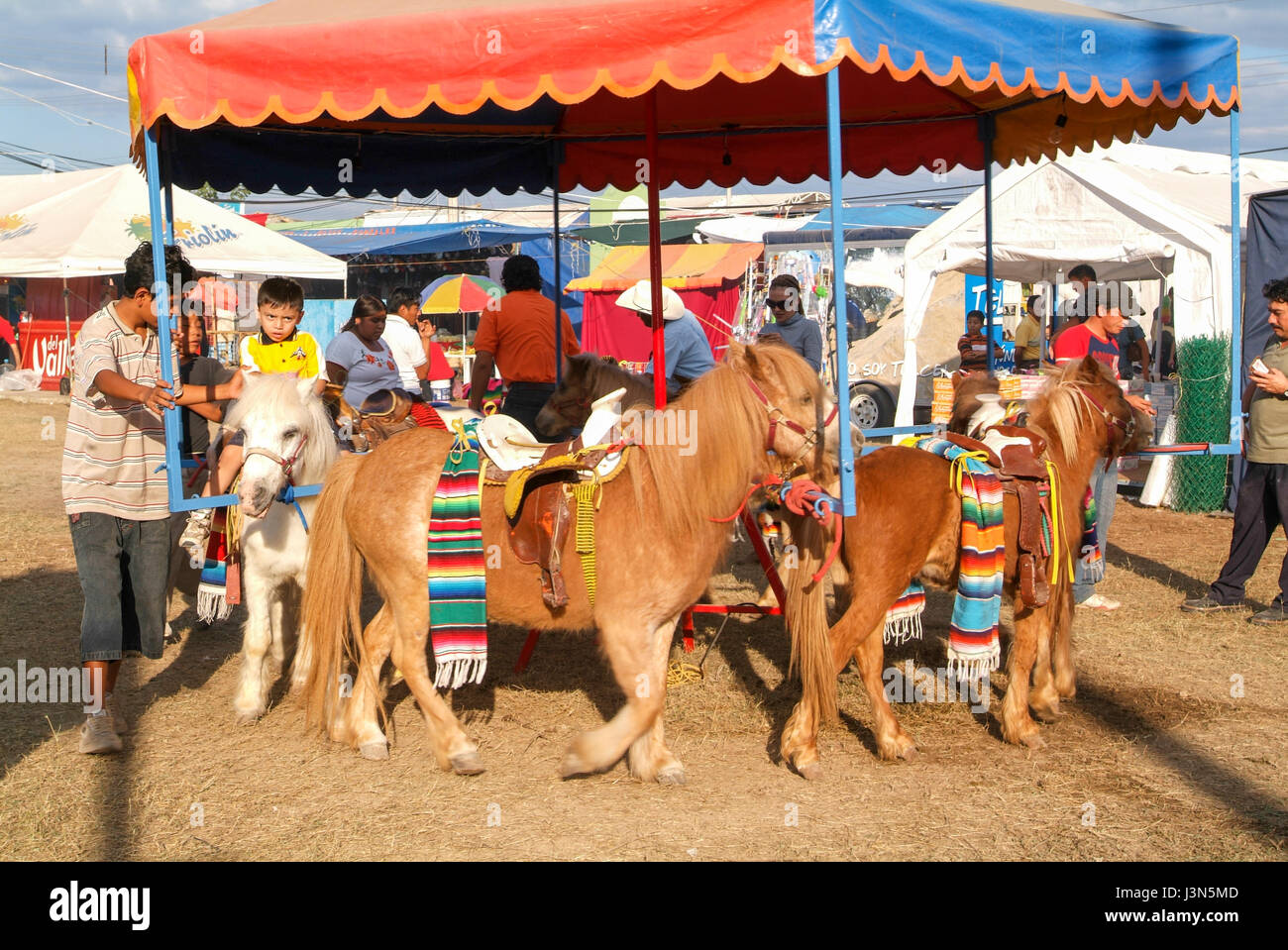 Woman riding carousel horse hi-res stock photography and images - Alamy