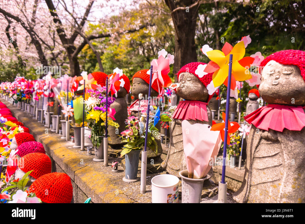 Jizo Japanese sculptures at Zojoji Temple in spring time at Tokyo Japan ...