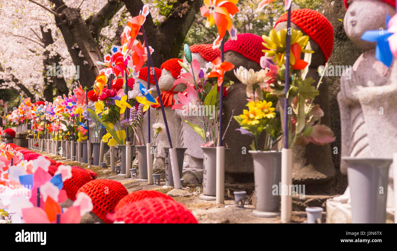 Jizo Japanese sculptures at Zojoji Temple in spring time at Tokyo Japan ...