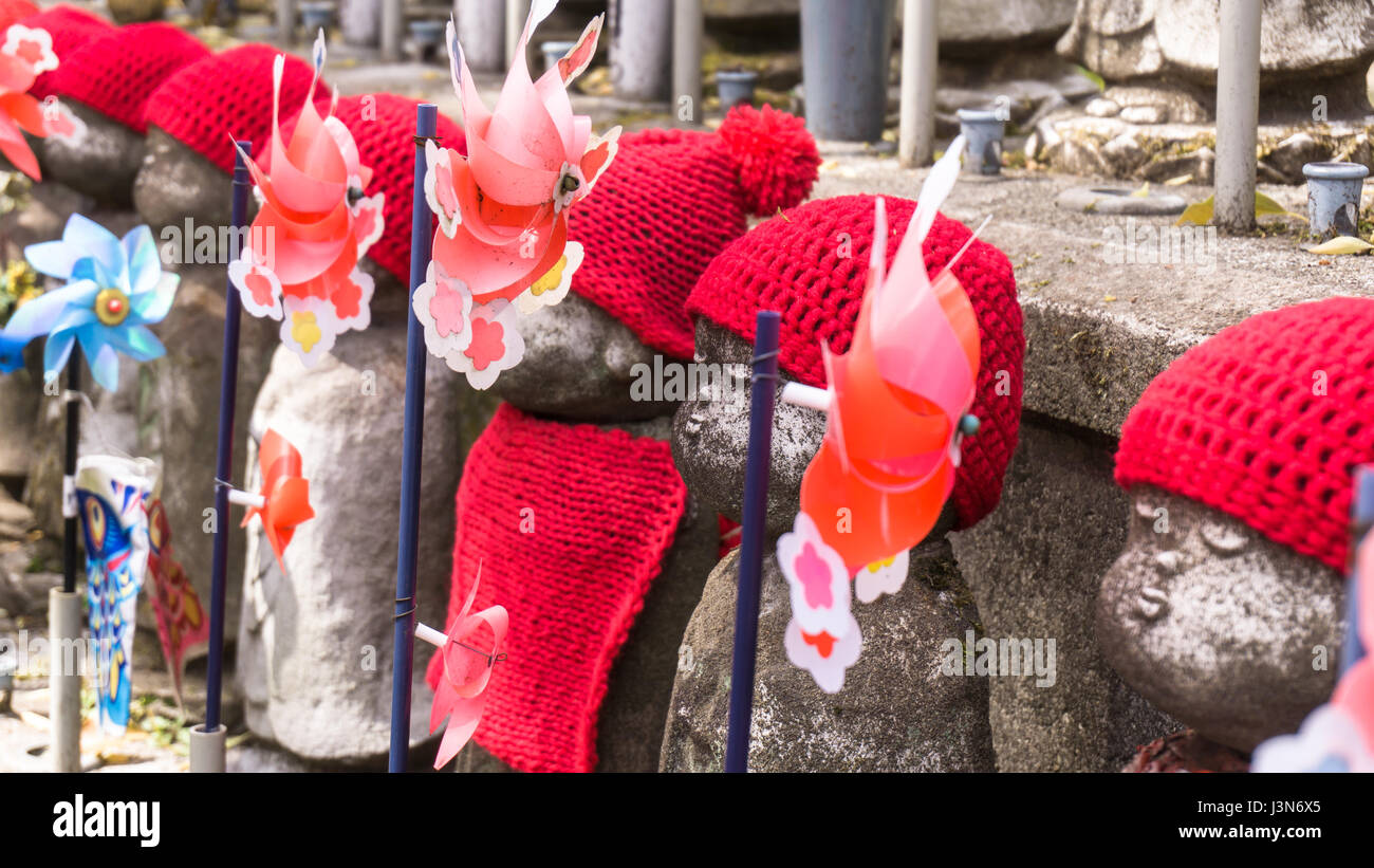 Jizo Japanese sculptures at Zojoji Temple in spring time at Tokyo Japan ...