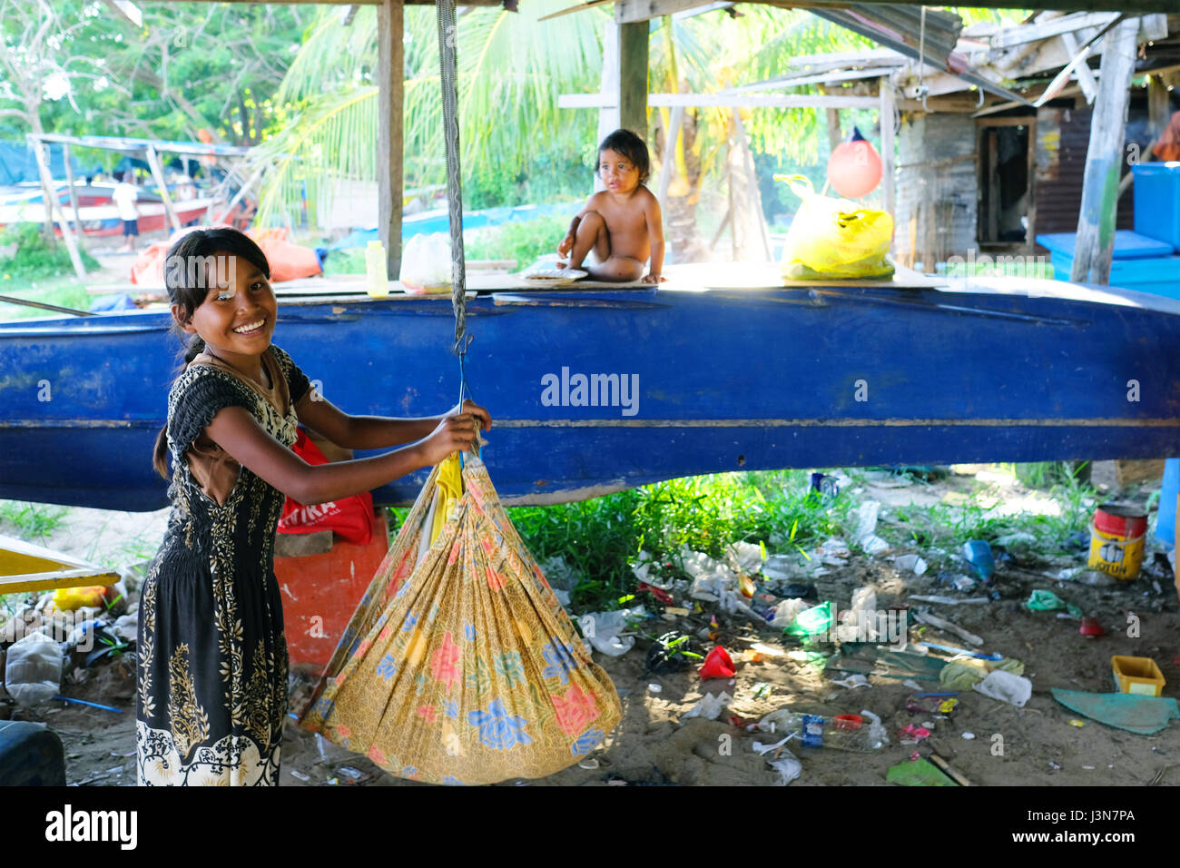 a little girl with her brother feel happy life as fishermen family ...