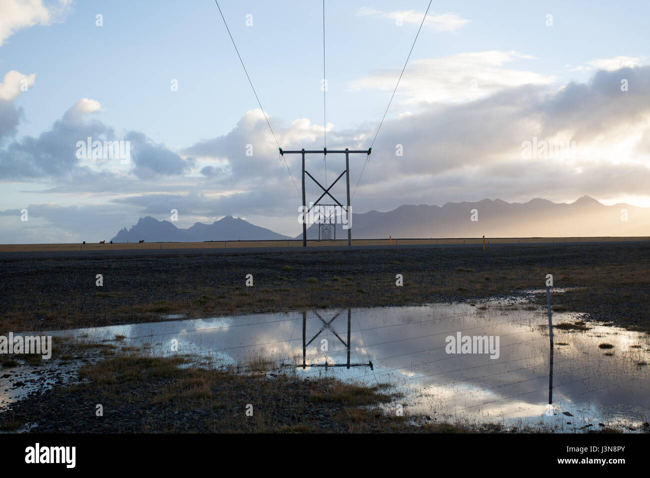 Power pole with sunset in Iceland. Light and shadow over the landscape ...