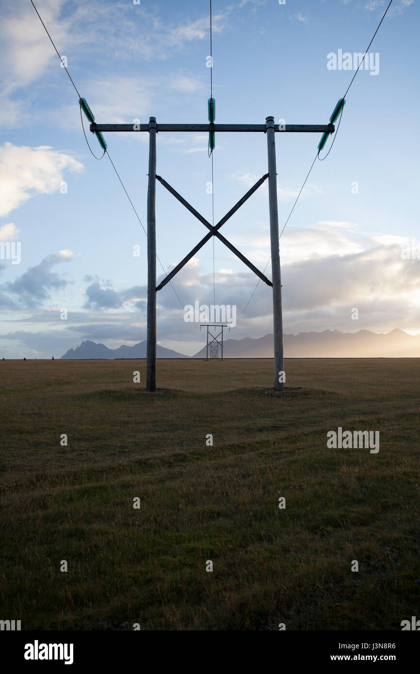 Power pole with sunset in Iceland. Light and shadow over the landscape ...