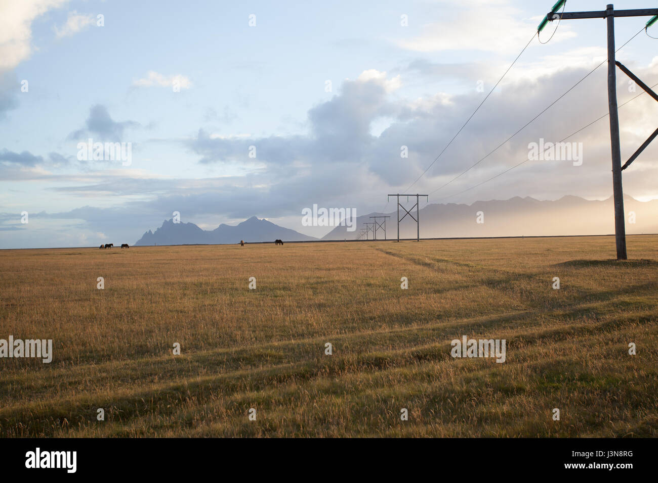 Power pole with sunset in Iceland. Light and shadow over the landscape ...