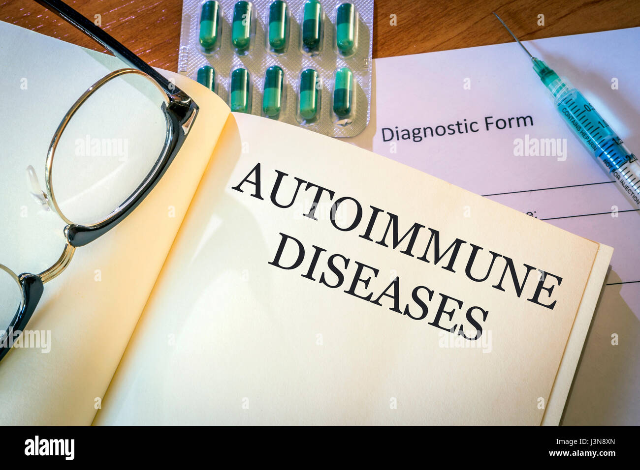 Book with diagnosis autoimmune diseases. Medic concept Stock Photo - Alamy
