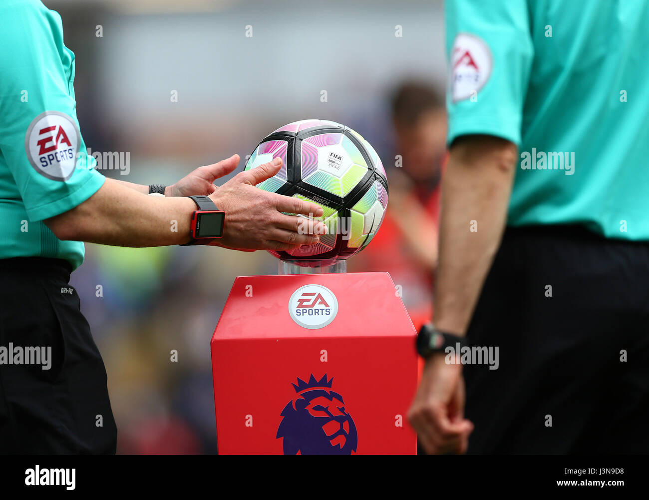 Referee Mike Jones grabs the match ball before Burnley's and West ...