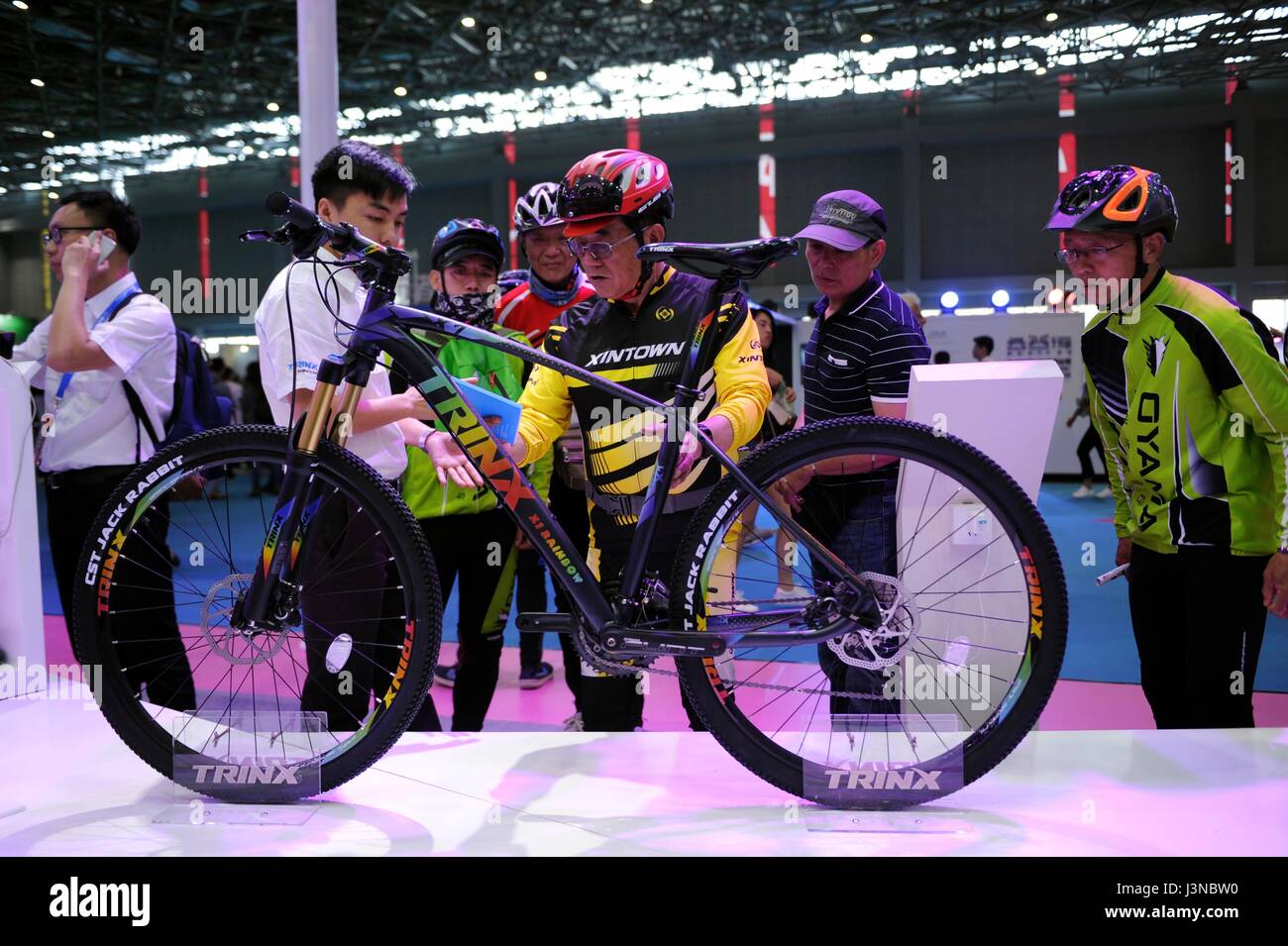 Shanghai, China. 6th May, 2017. An exhibitor introduces a bicycle ...