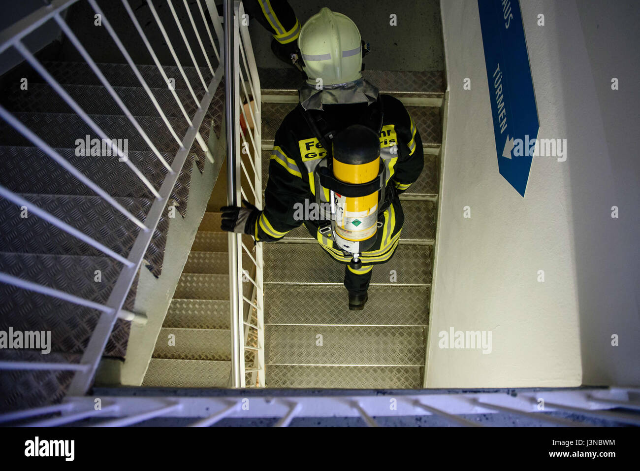 Berlin, Germany. 06th May, 2017. A firefighter walks up the stairs of ...