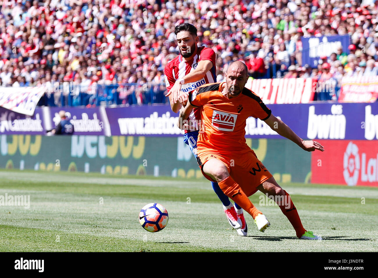 Ivan Ramis (4) SD Eibar's player. Yannick Carrasco (10) Atletico de ...
