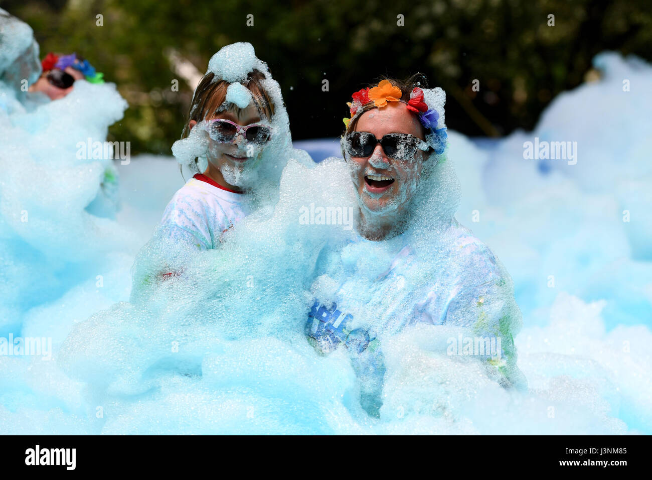 Participants enjoy the race around a course of bubbles in Dorset's ...