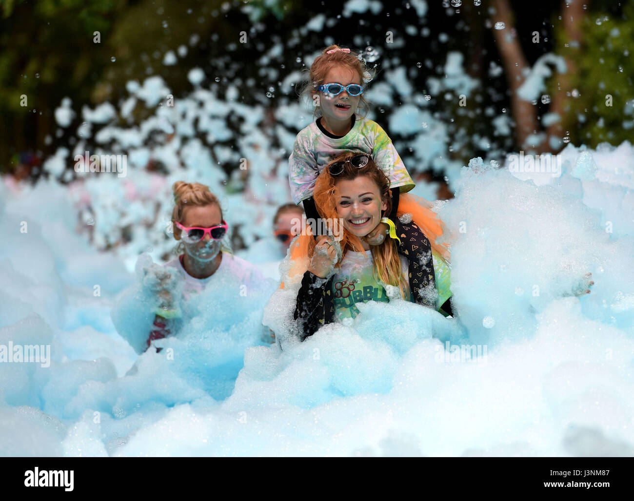Participants enjoy the race around a course of bubbles in Dorset's ...