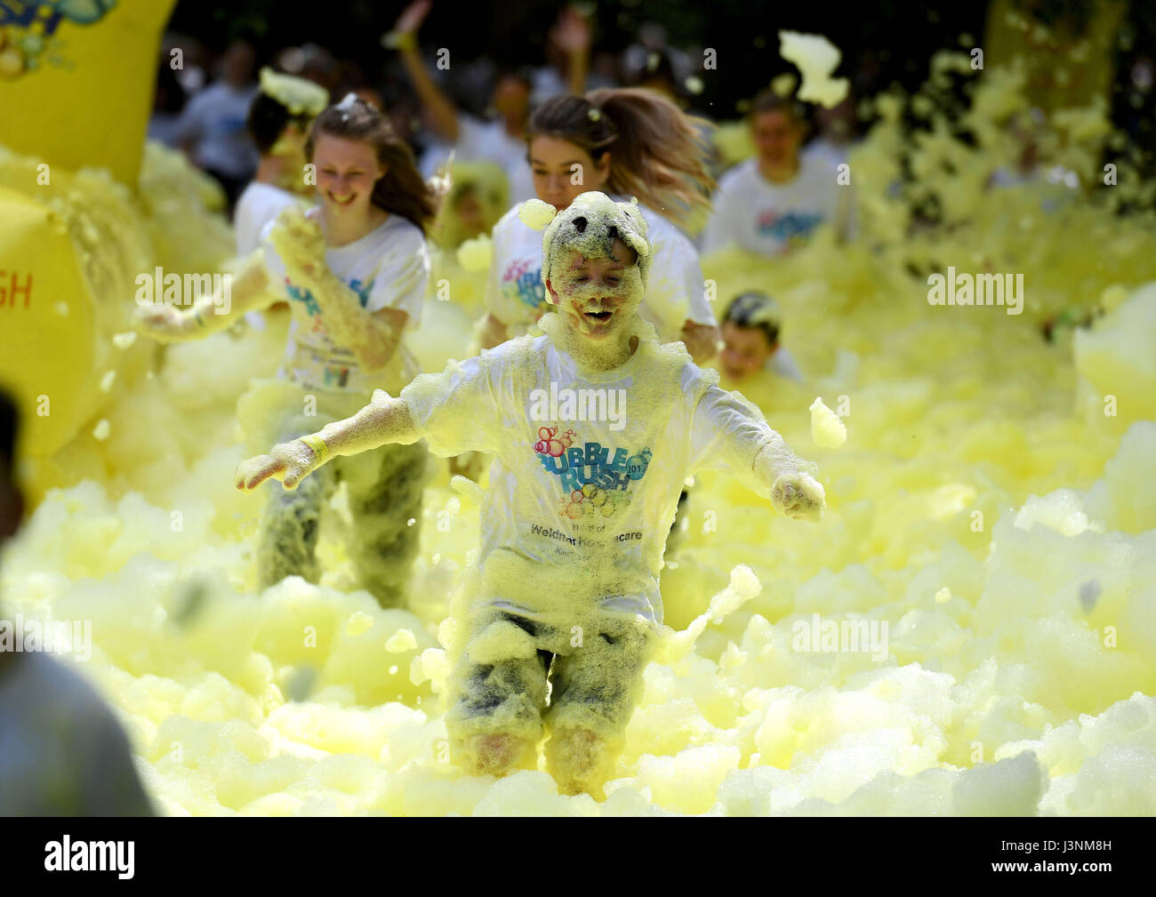 Participants enjoy the race around a course of bubbles in Dorset's ...