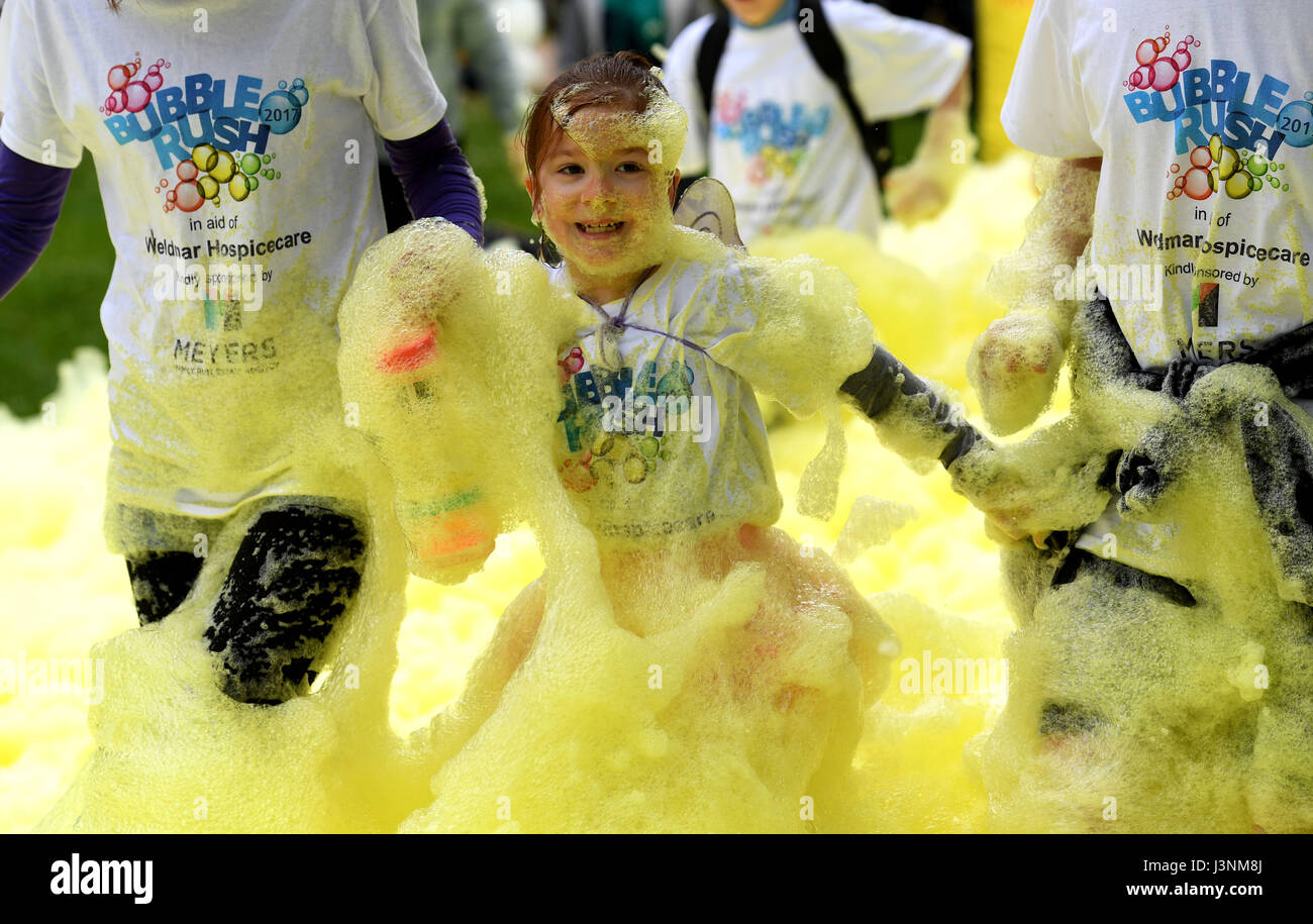 Participants enjoy the race around a course of bubbles in Dorset's ...