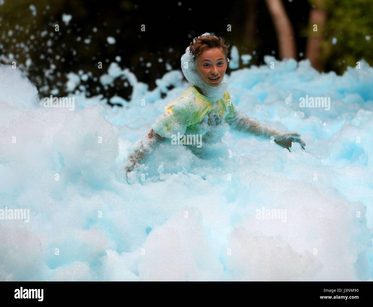 Participants enjoy the race around a course of bubbles in Dorset's ...