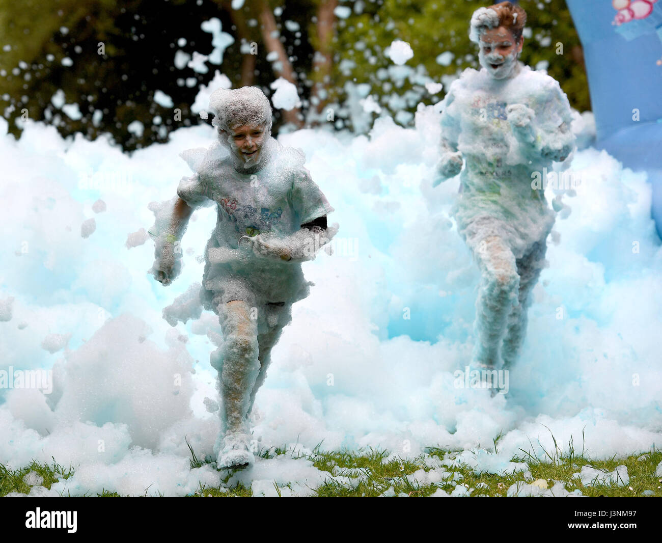Participants enjoy the race around a course of bubbles in Dorset's ...