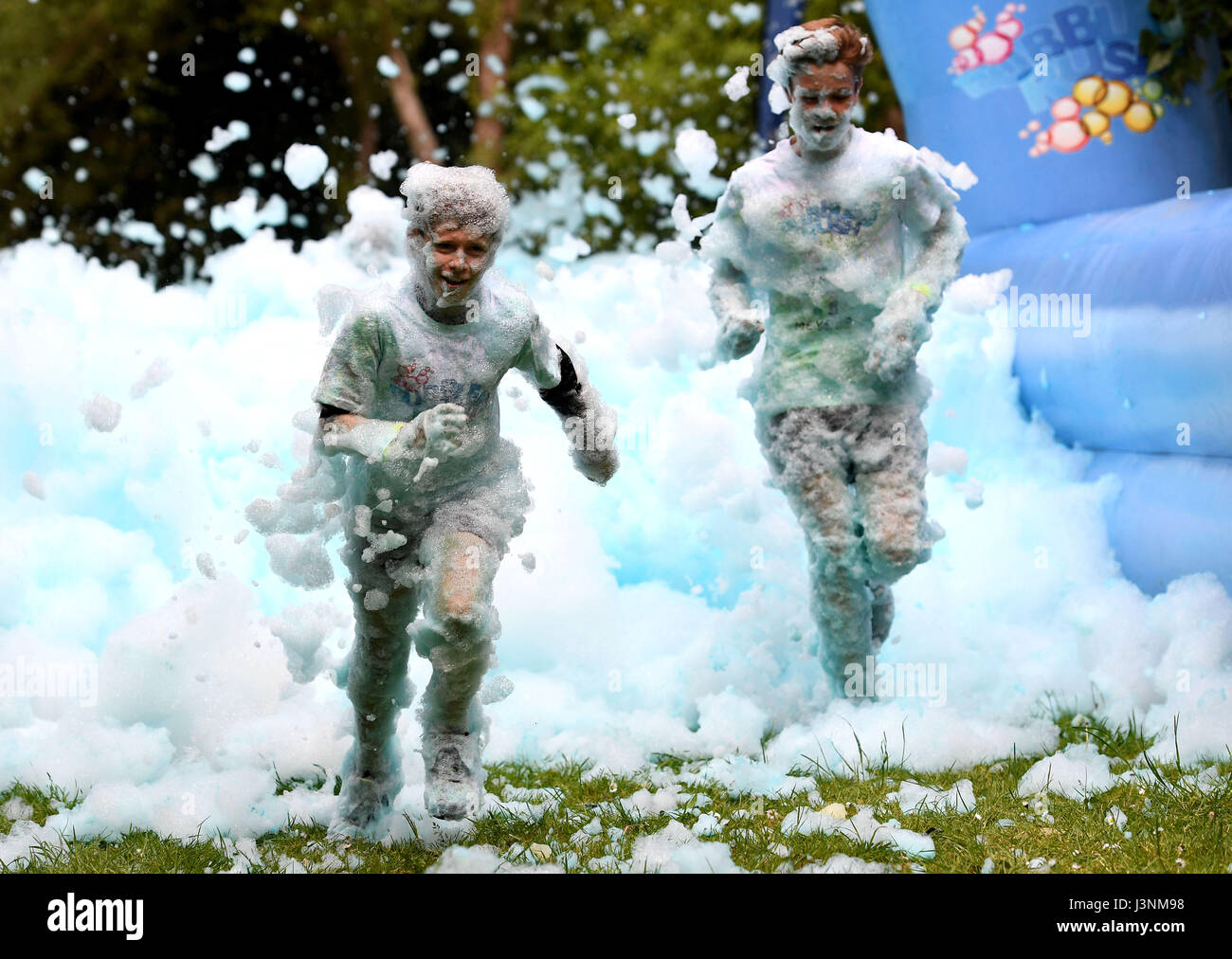 Participants enjoy the race around a course of bubbles in Dorset's ...