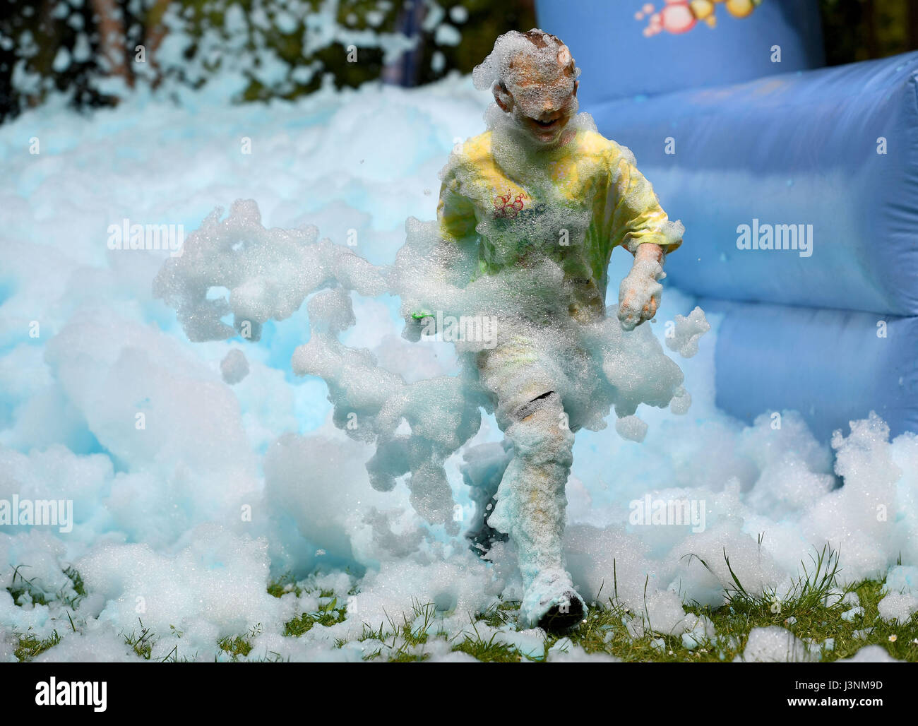 Participants enjoy the race around a course of bubbles in Dorset's ...