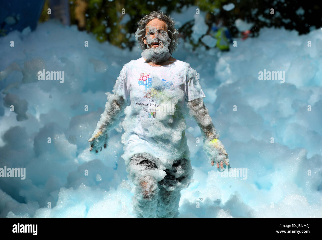 Participants enjoy the race around a course of bubbles in Dorset's ...