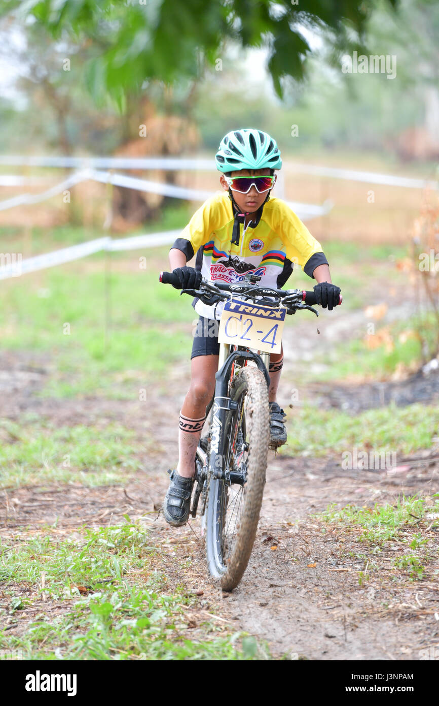 Singburi, Thailand. 7th May 2017. Biker riding a mountain bike at ...