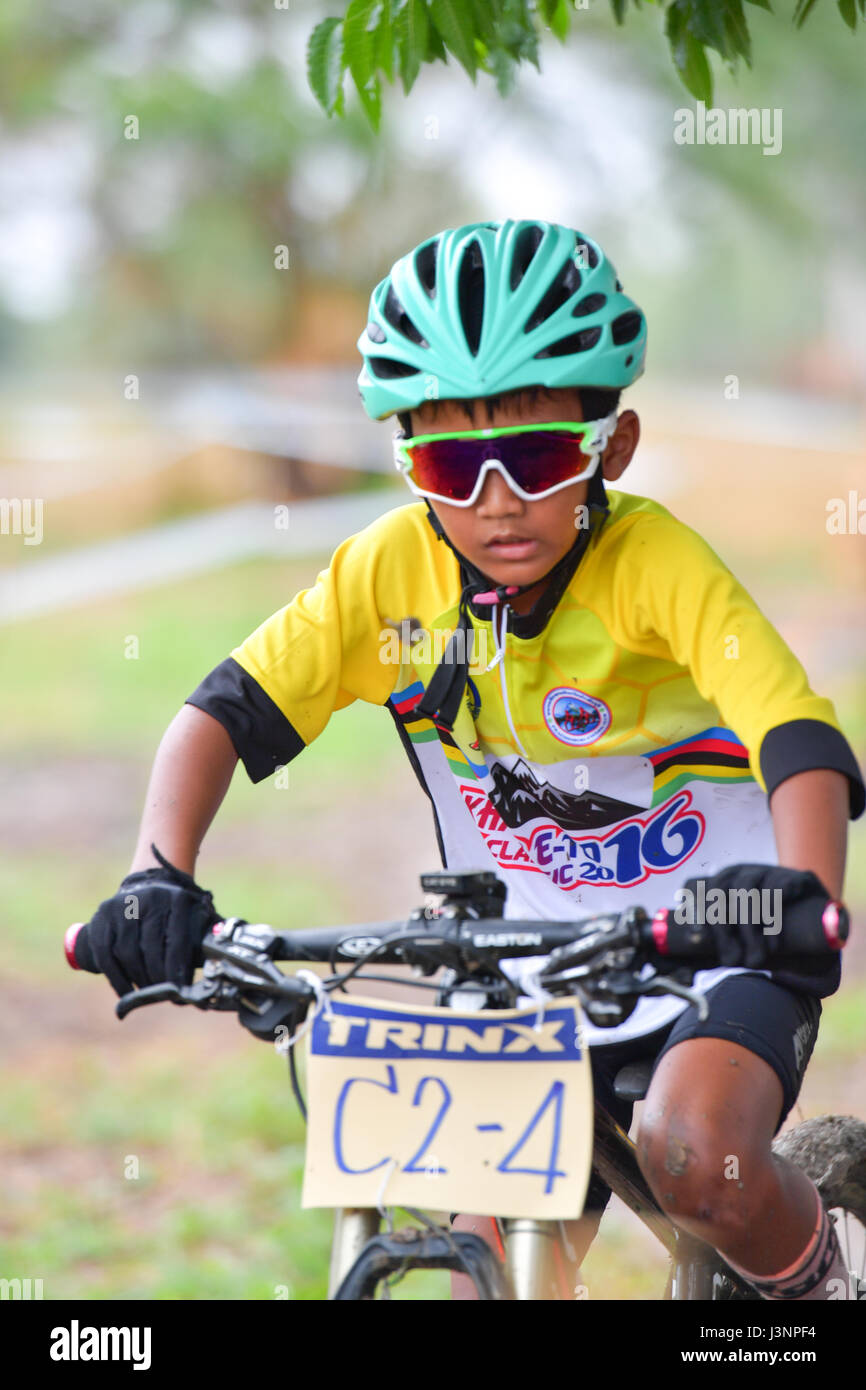 Singburi, Thailand. 7th May 2017. Biker riding a mountain bike at ...