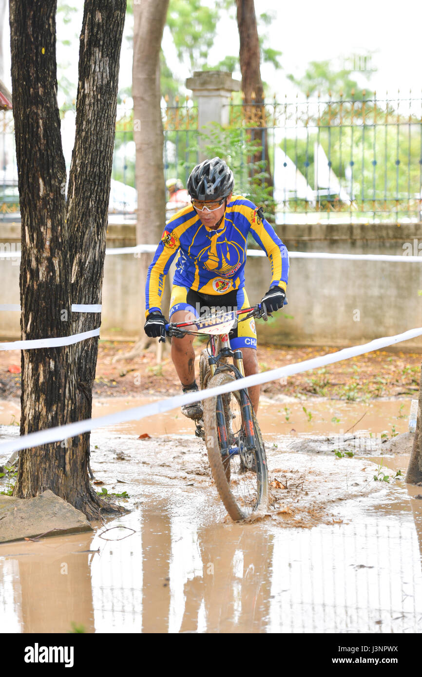 Singburi, Thailand. 7th May 2017. Biker riding a mountain bike at ...