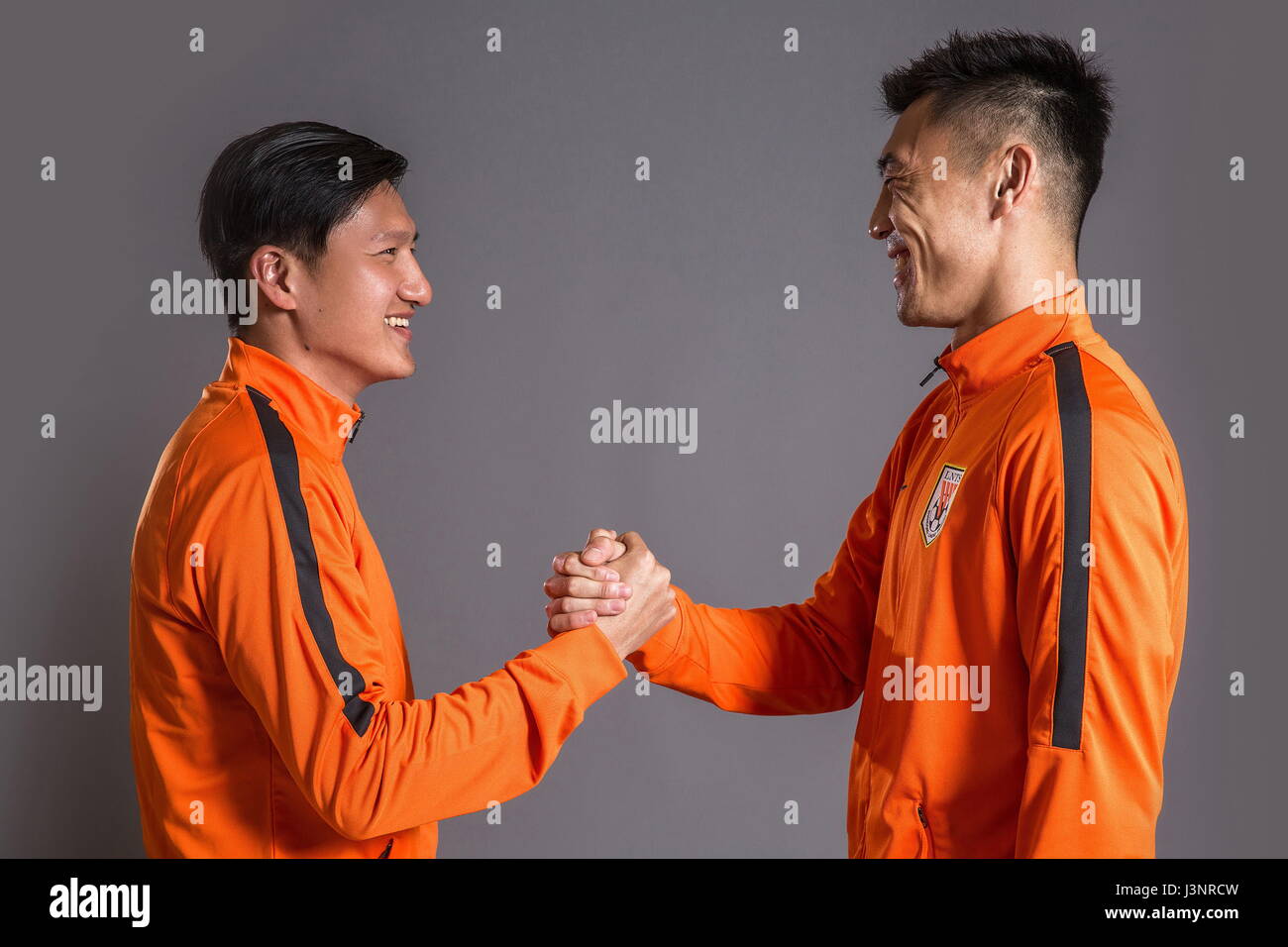 Portrait of Chinese soccer players Jiang Jiajun, left, and Zheng Zheng of Shandong Luneng ...
